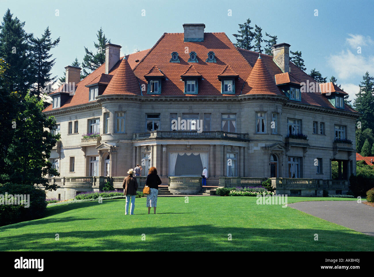 Pittock Mansion with tourists looking at the historic home of Henry and ...