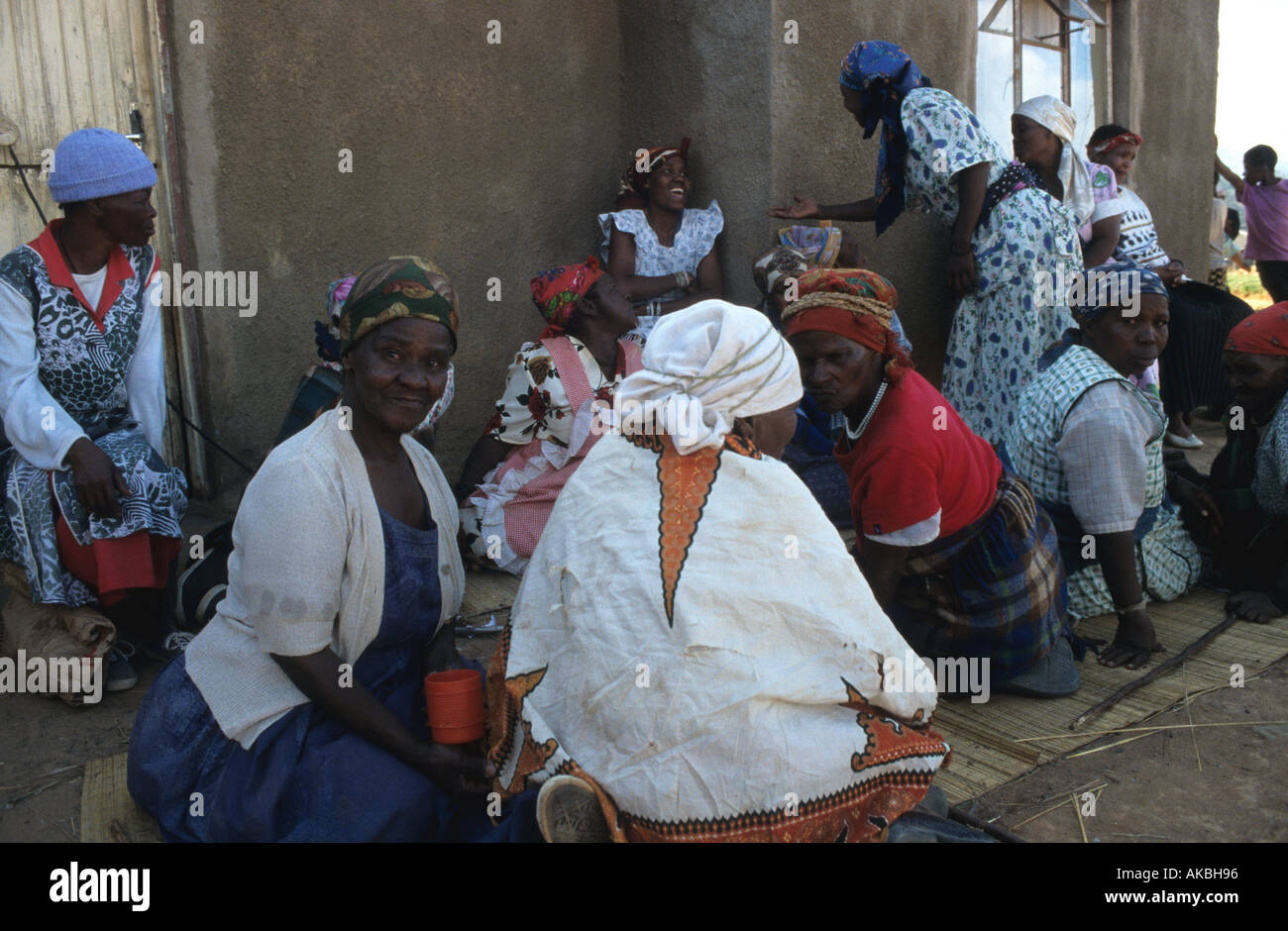 Local villagers forming groups outside their houses South Africa Stock ...