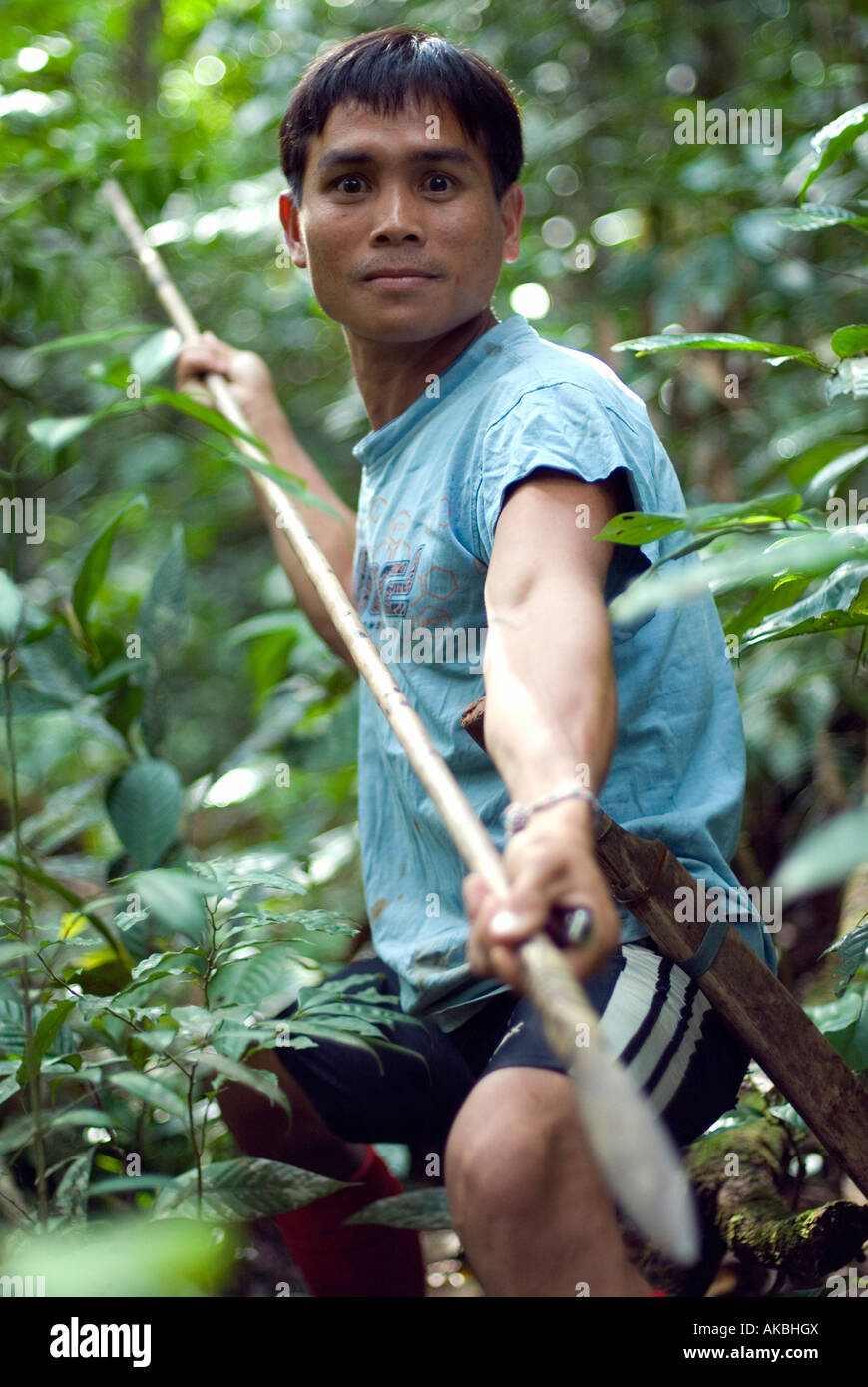 A young Dayak man poses during a pig hunting expedition in the Borneo ...