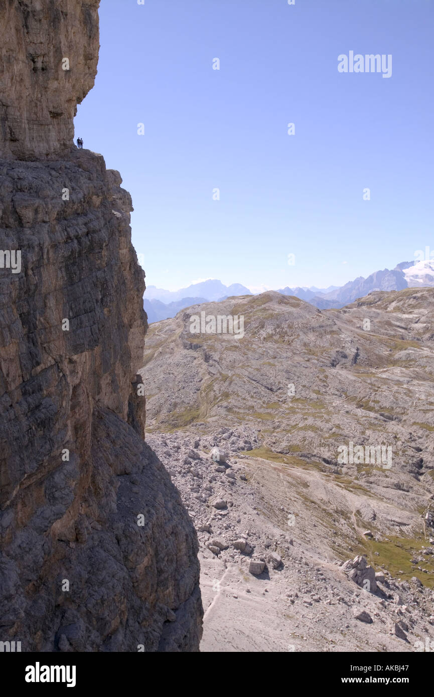 climbers on an extremely exposed high level ledge on the via ferrata ...