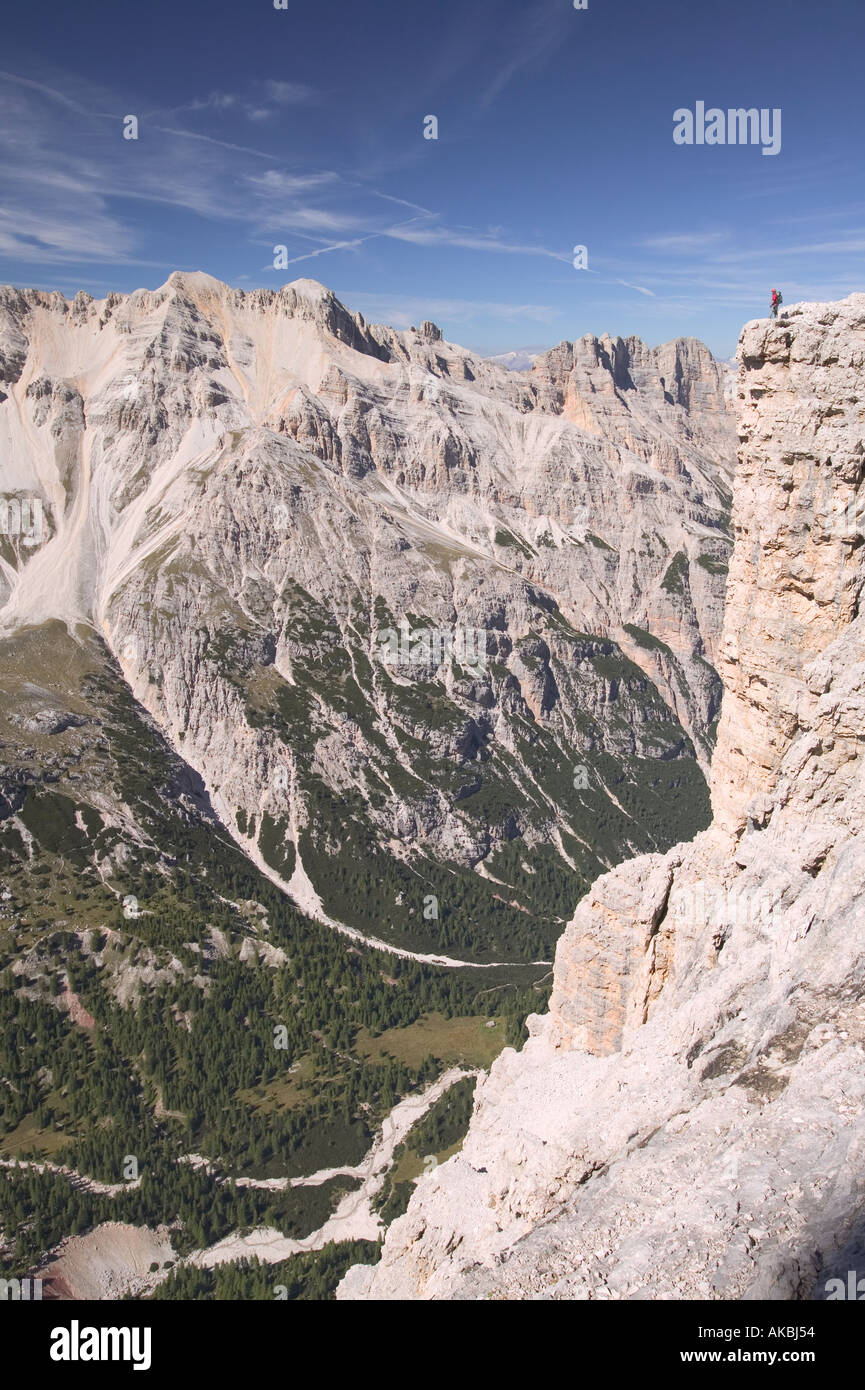 climber looking over an extremely exposed cliff section on the via ...