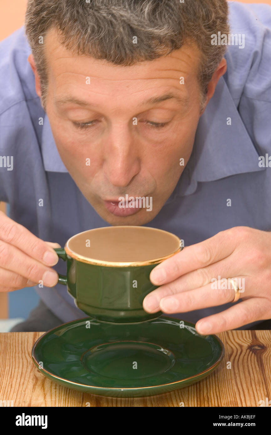 Overfull cup hi-res stock photography and images - Alamy