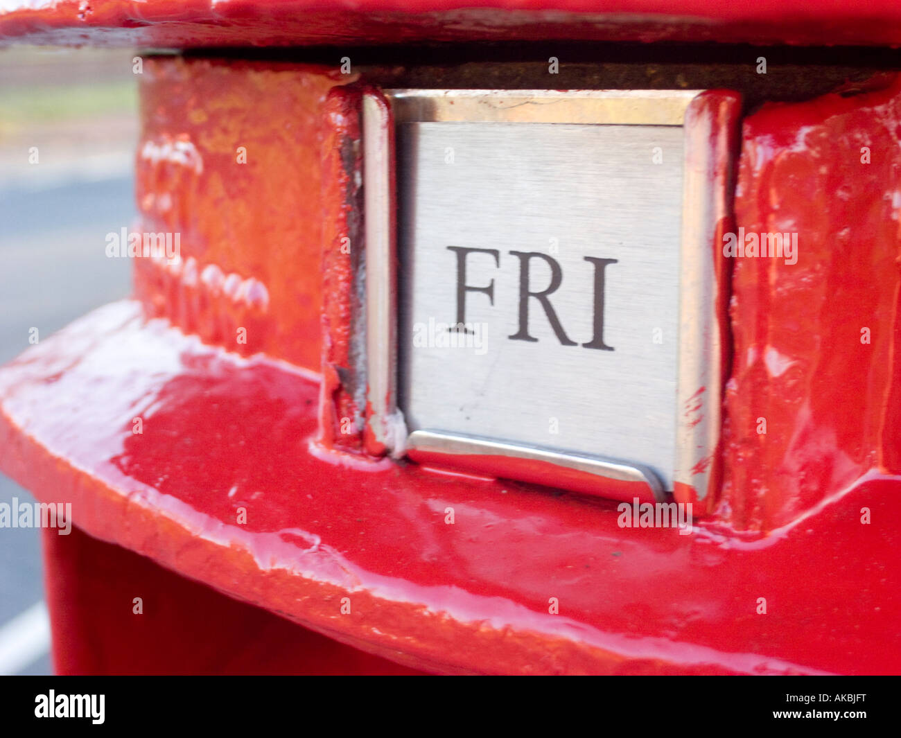 the label on a UK postbox that indicates which day the next collection ...