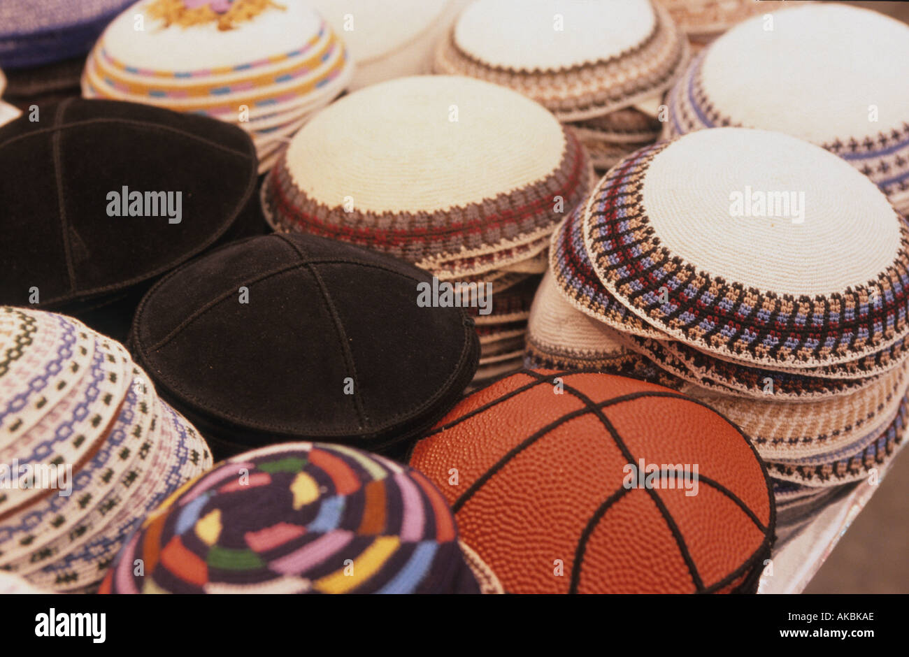 Stacked variety of skull caps on market stall, Israel, Middle East ...