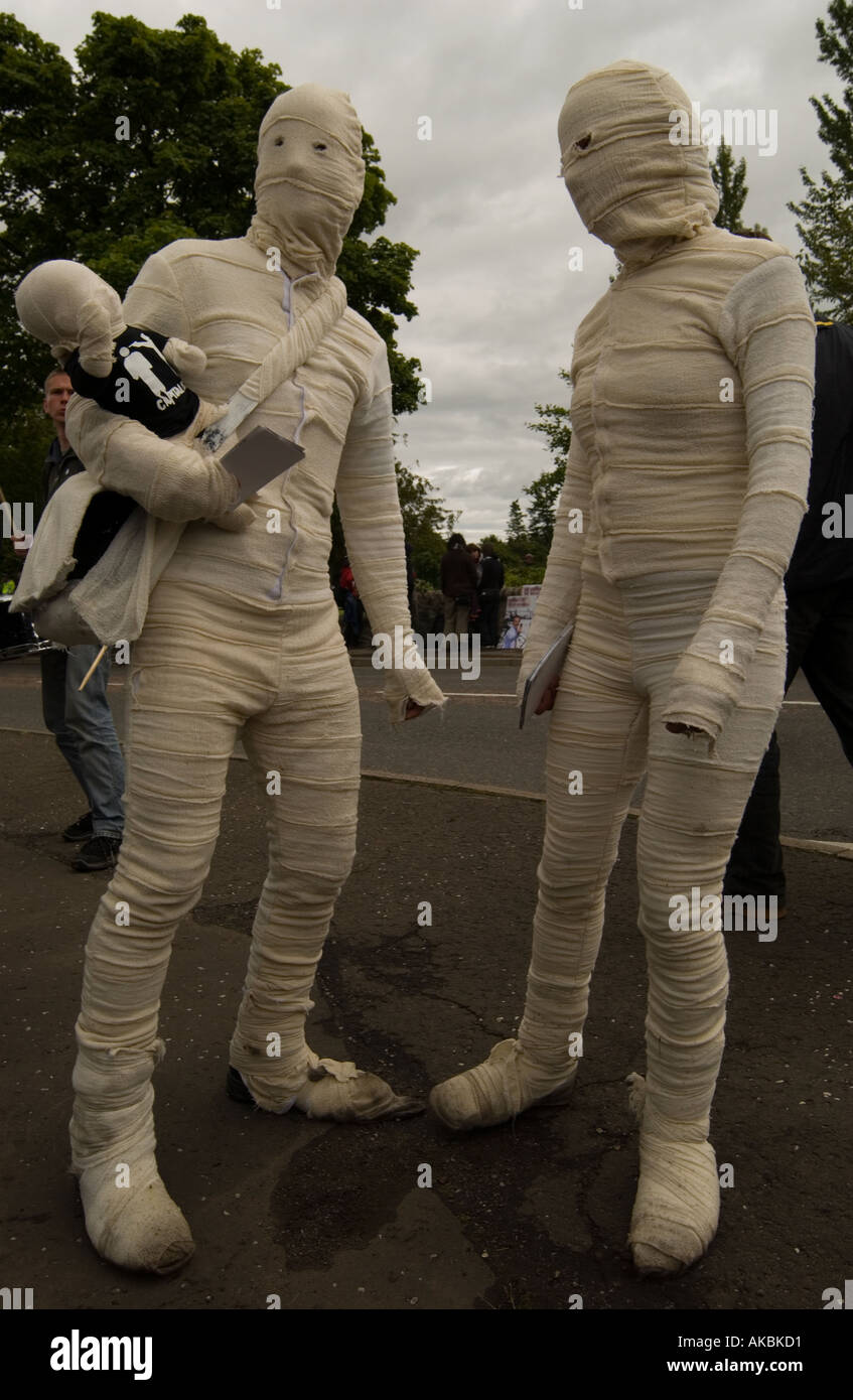 Couple with baby dressed as mummies Stock Photo - Alamy
