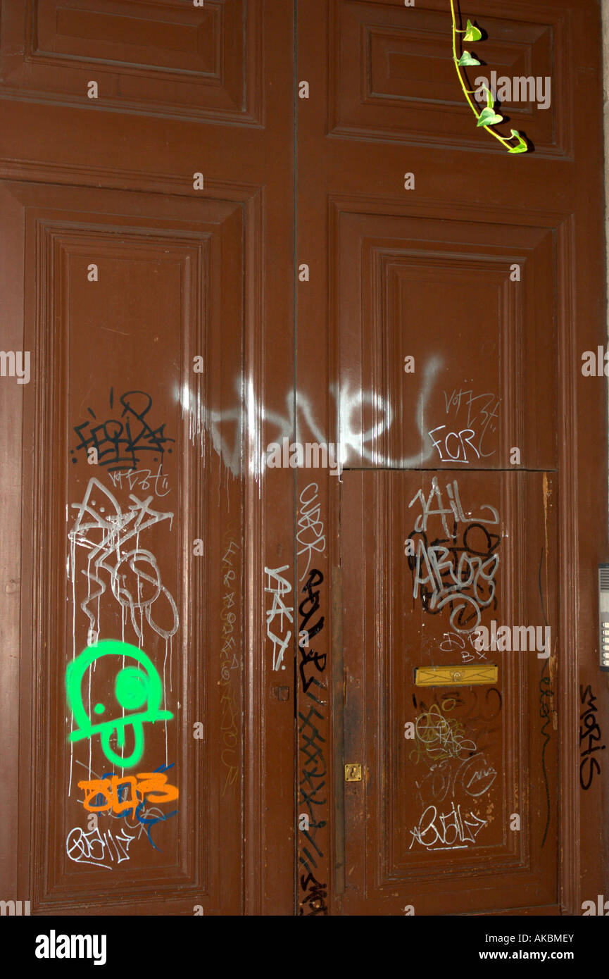 Graffiti on a door in Barcelona Stock Photo - Alamy