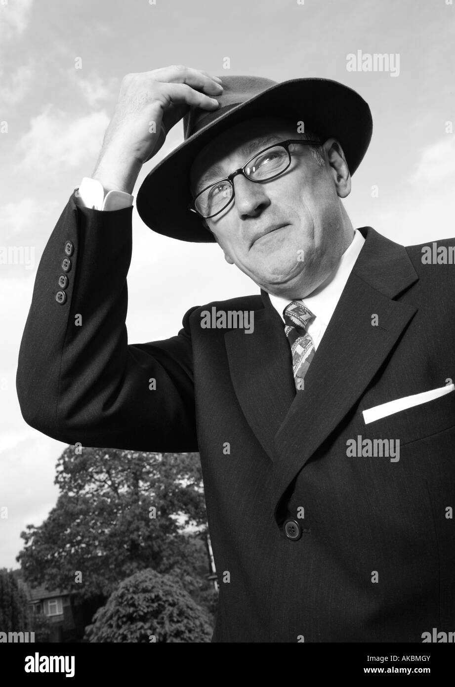 Old fashioned middle aged man tips his hat, black and white Stock Photo ...