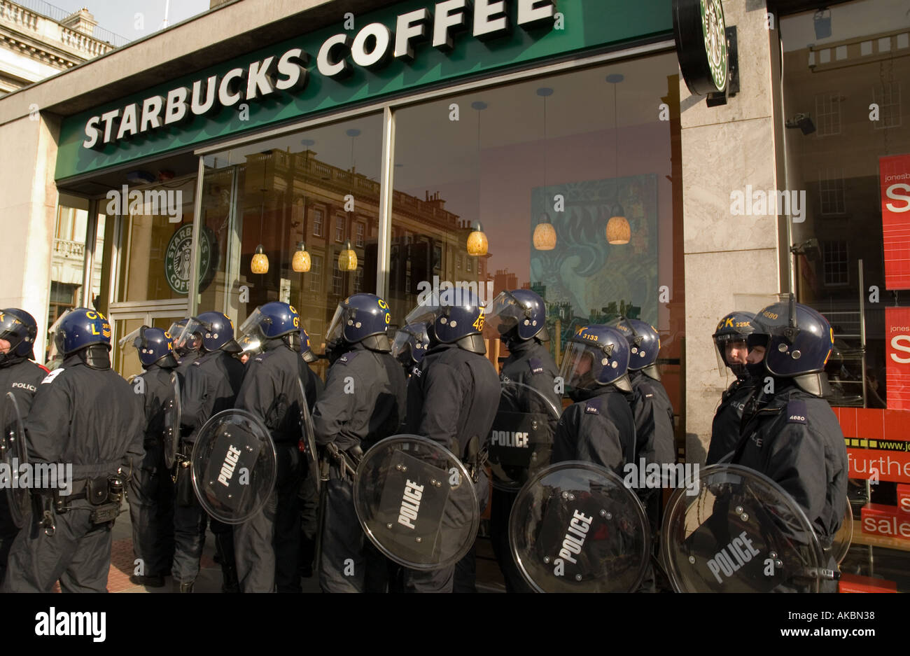 Riot police in full uniform assembled outside a branch of Starbucks ...