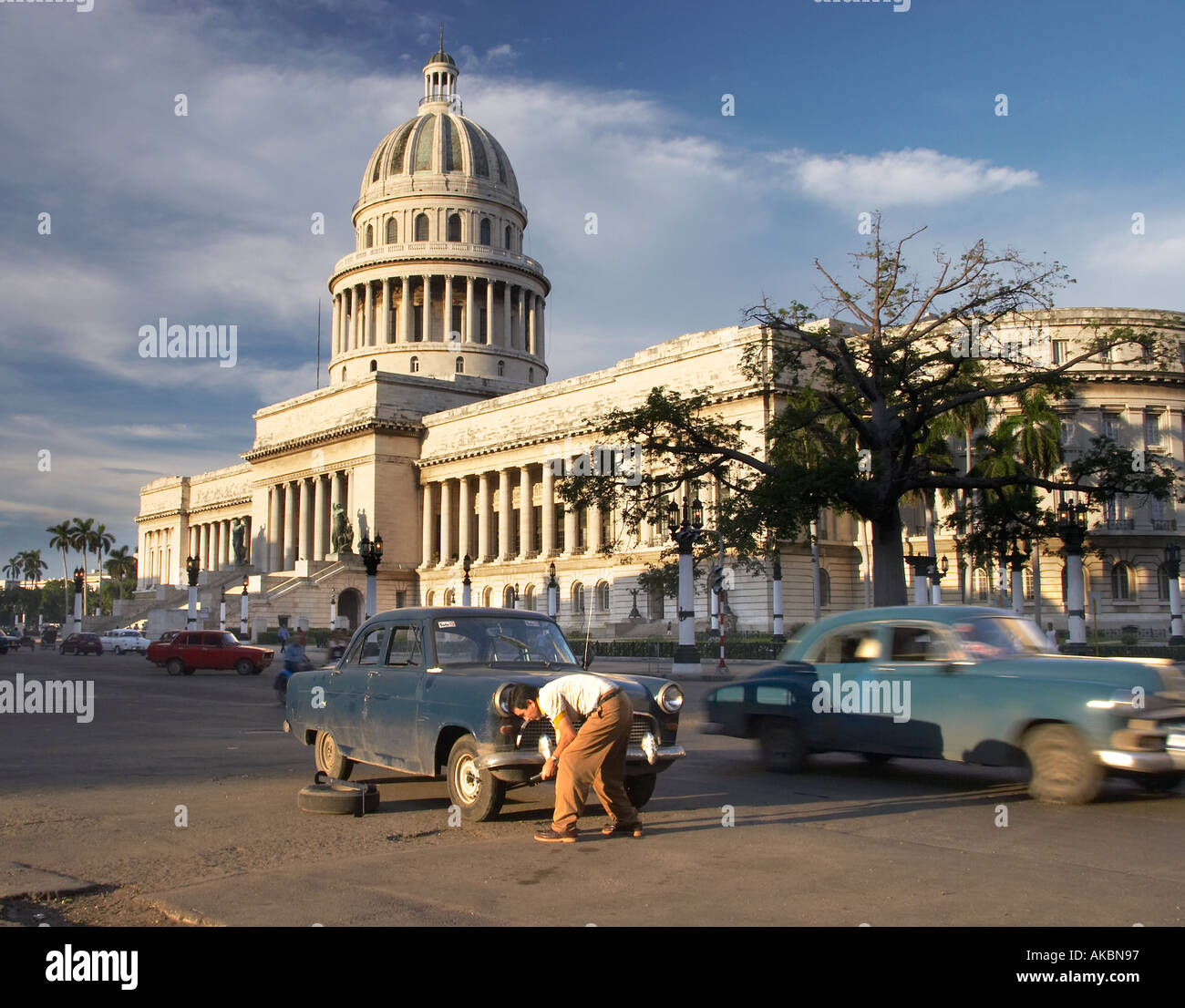 The Capital Building Central Havana Cuba with man repairing broken down ...