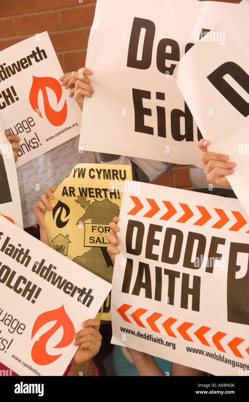 welsh language protesters holding banners calling for a new language ...