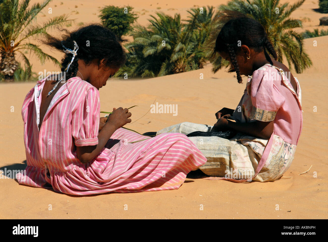 Children making handicrafts for tourists Adrar desert Mauritania Stock ...