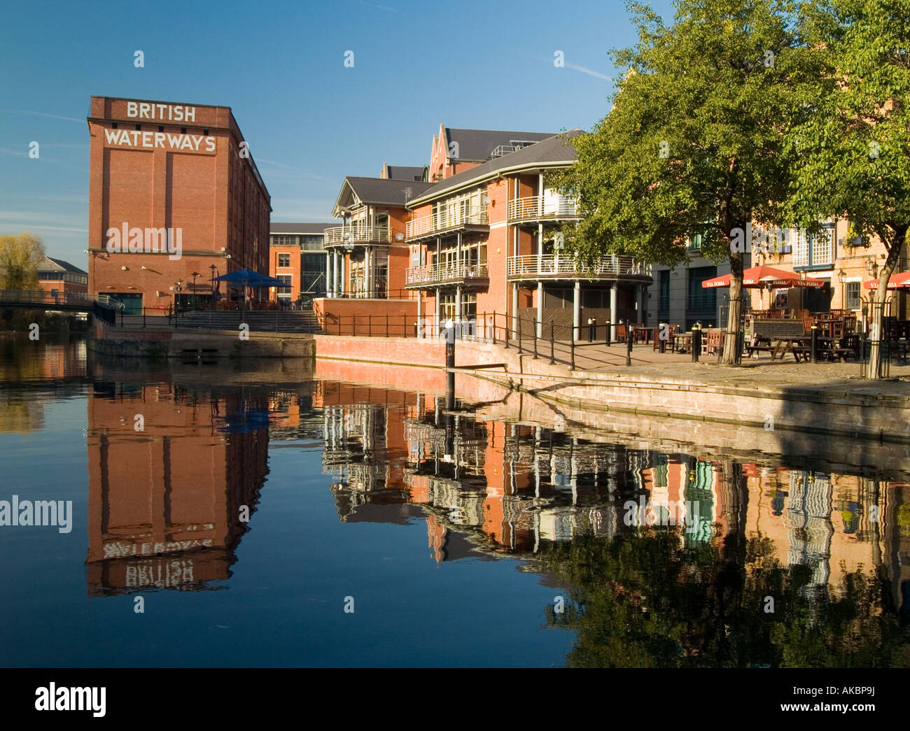 Buildings, pubs and restaurants reflected in the canal at Nottingham ...