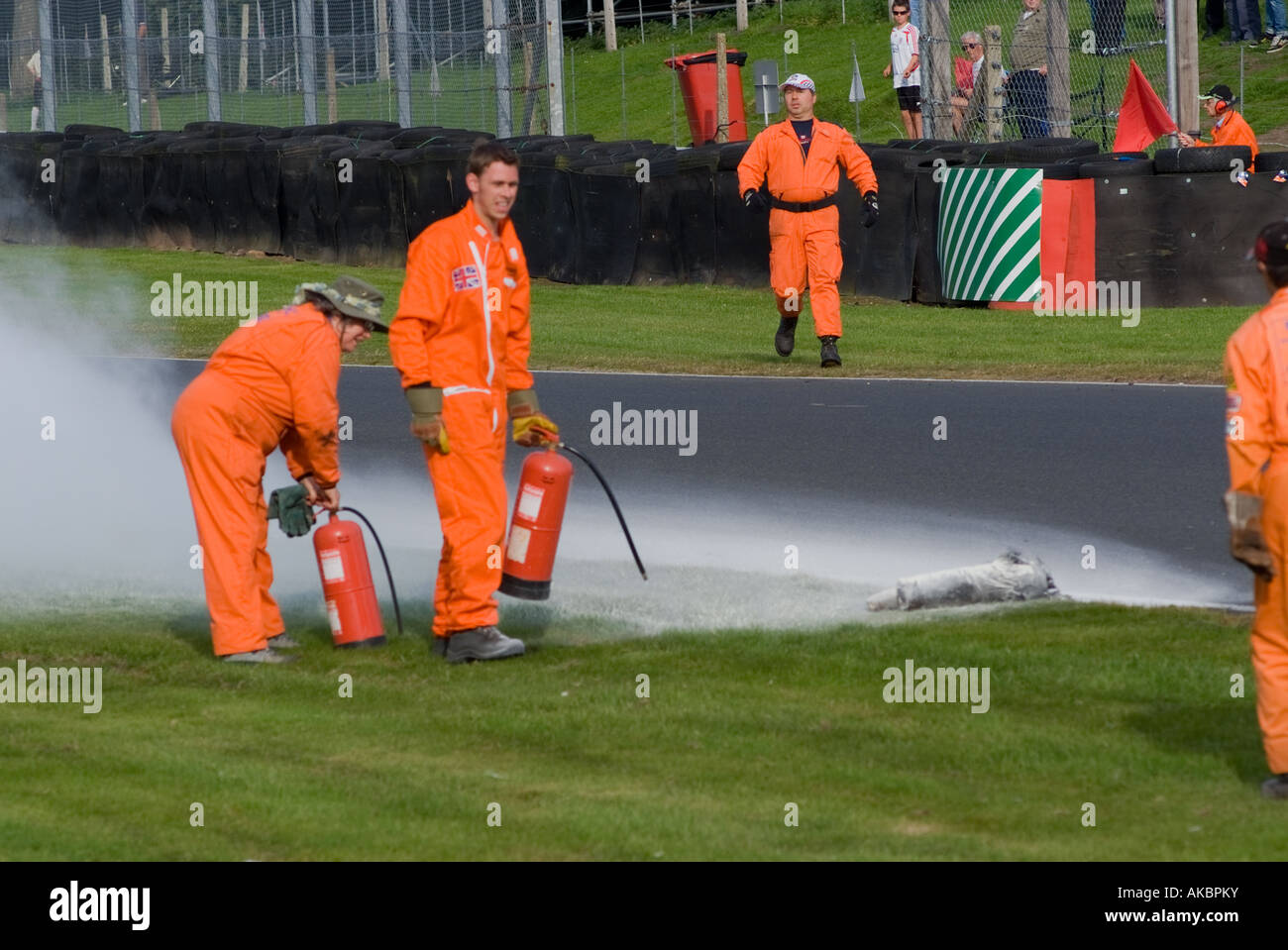 Marshals with Fire Extinguishers having Put Out Fire on Car Exhaust at ...