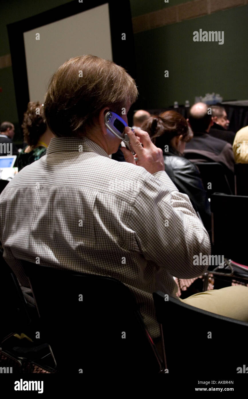 Man making cell mobile phone call in Theater Stock Photo - Alamy