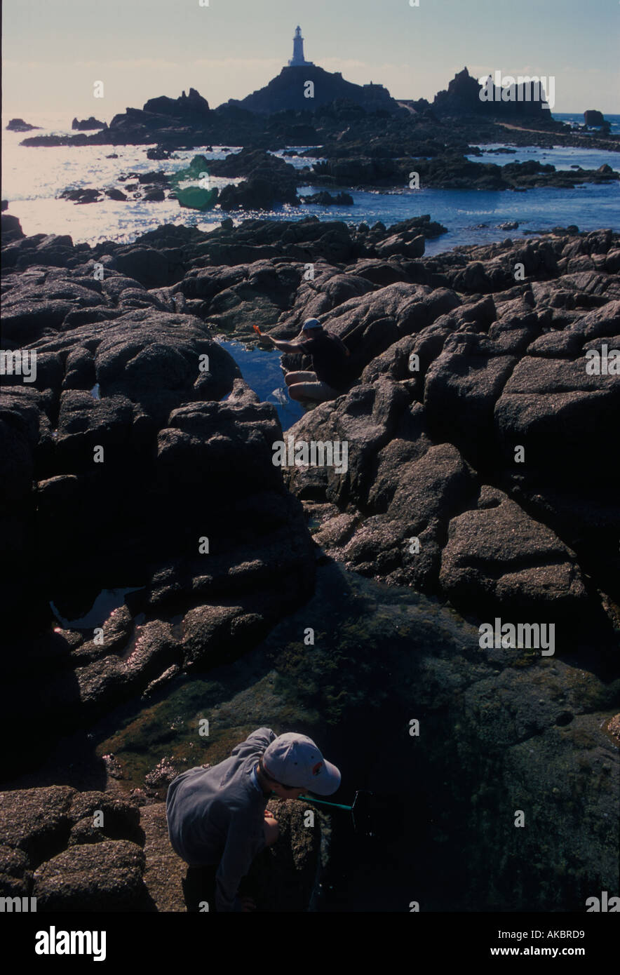 Rock pool in front of Corbiere Lighthouse Jersey Channel Islands Stock Photo - Alamy