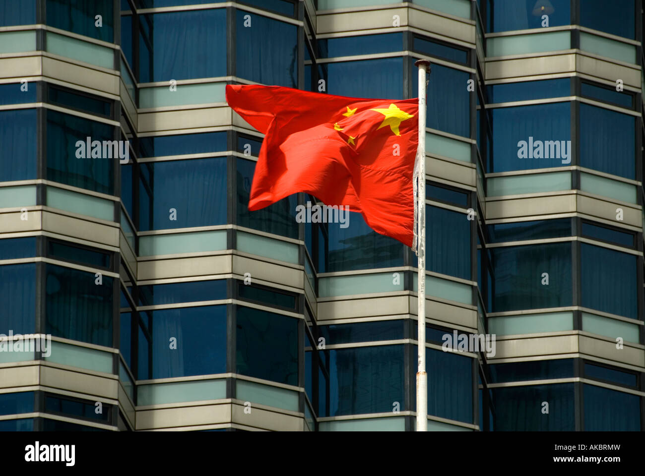 Chinese flag against modern building Hong Kong Stock Photo - Alamy
