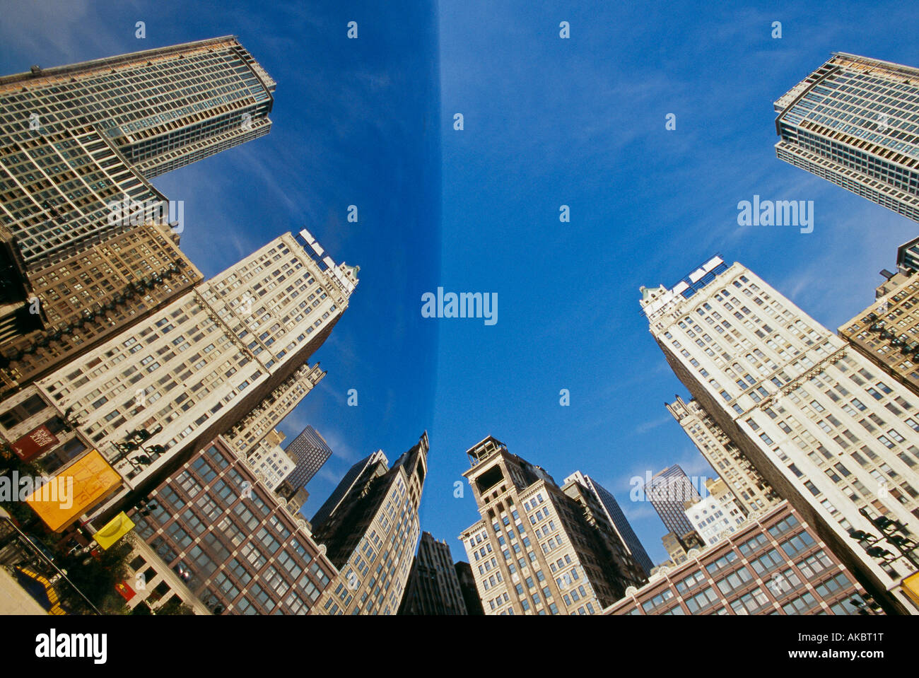 Office buildings reflected in the mirror like surface of Cloud Gate ...