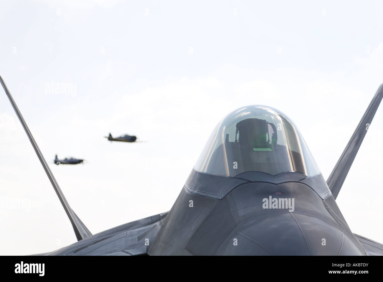 F-22 Raptor cockpit and two T-6 Texan aircraft fly by Stock Photo - Alamy
