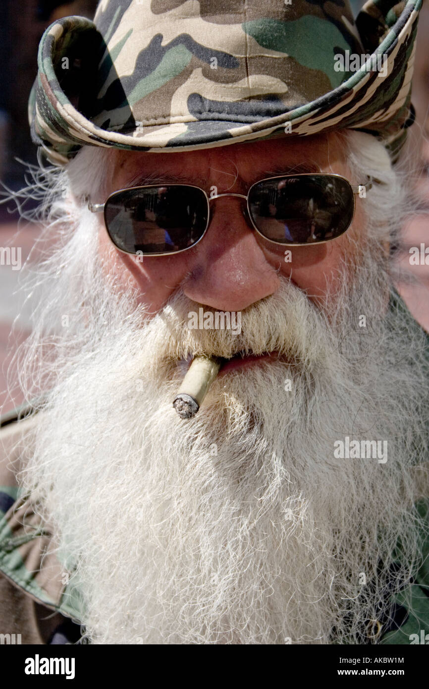 Older man with long white beard camouflage jacket and cheroot Stock ...