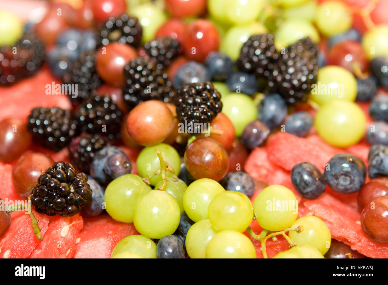 mixed fruit plate with berries Stock Photo - Alamy