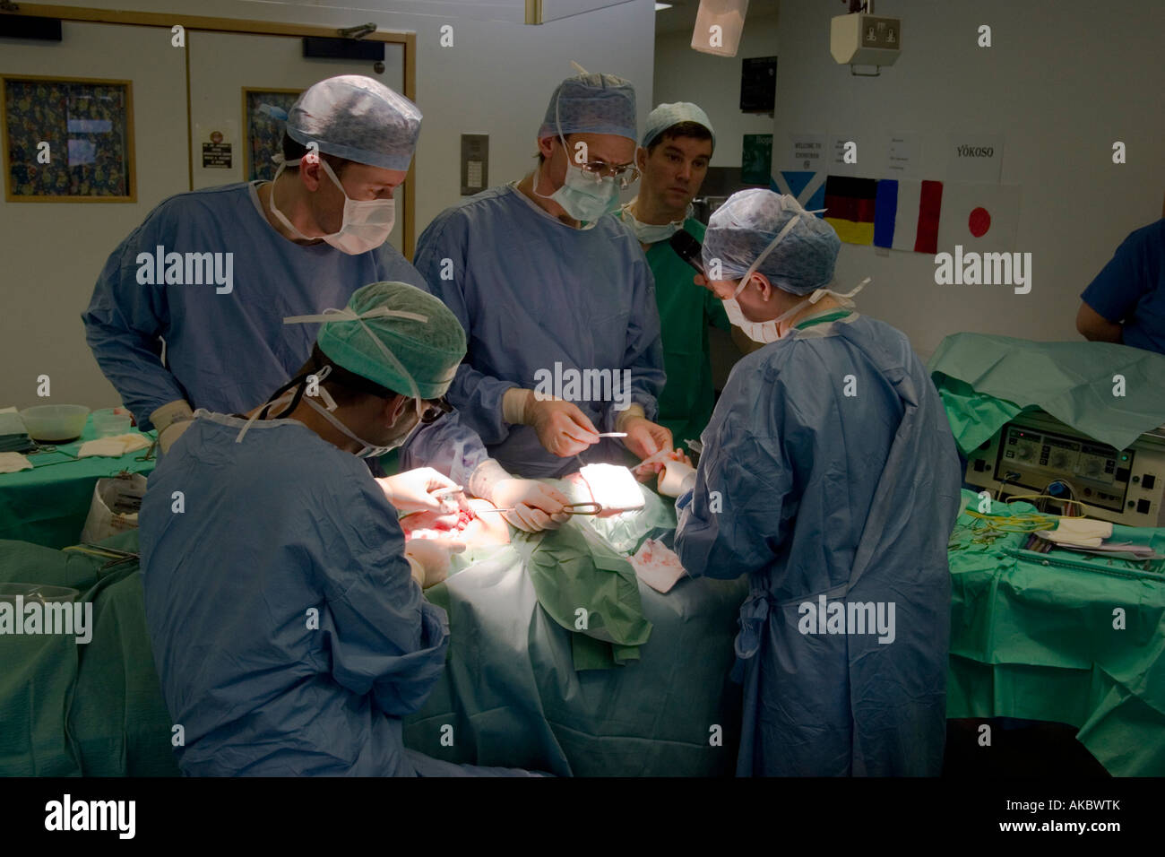 Plastic surgeons operating on a patient Stock Photo - Alamy