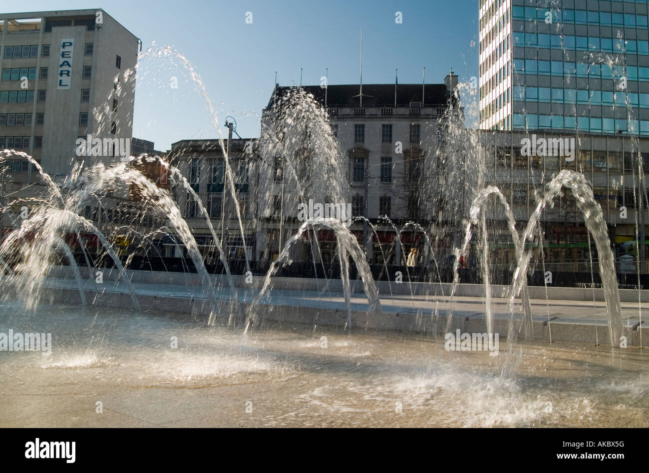 A view through the fountains in the Market Square to shops and ...