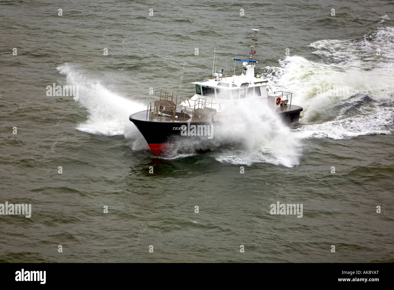 Pilot Boat rough ocean Stock Photo - Alamy