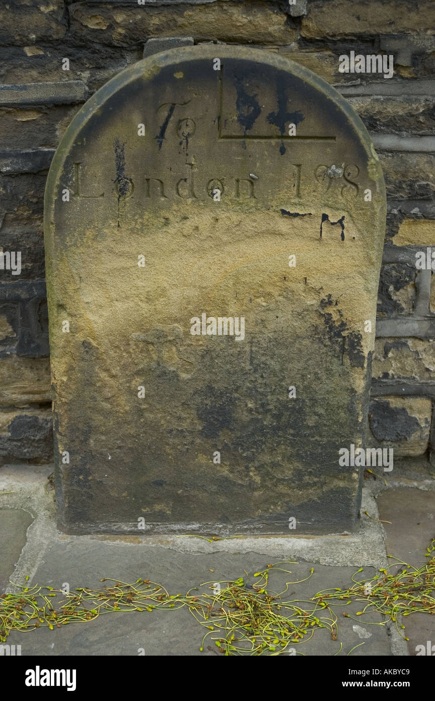 Ancient milestone showing 198 miles to London Halifax West Yorkshire uk ...
