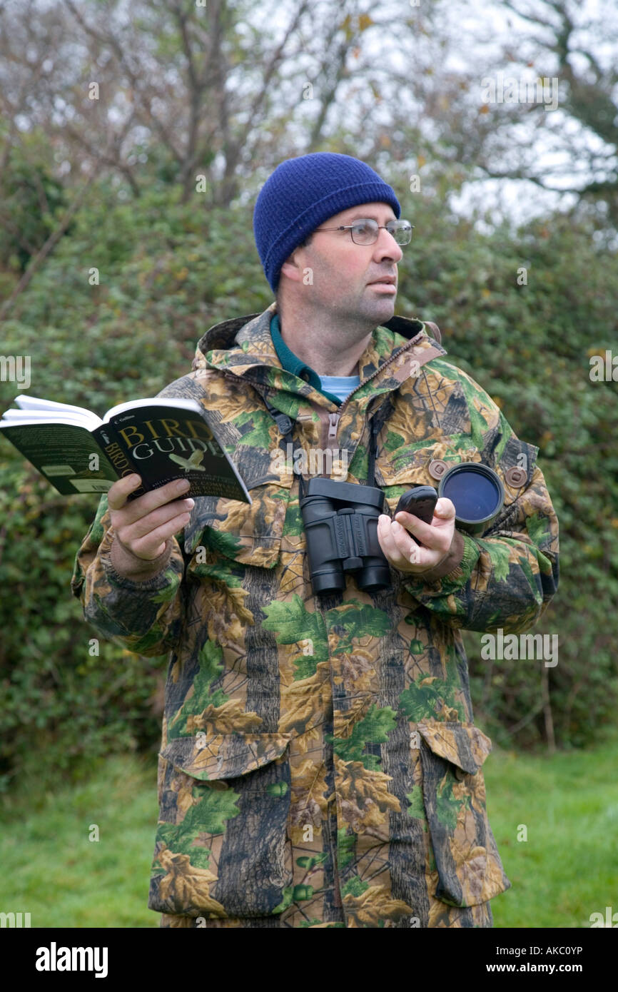bird watcher with phone binoculars guide and telescope Stock Photo - Alamy