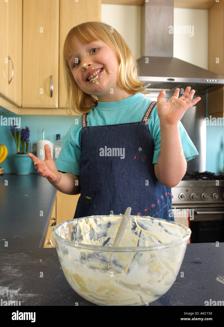 Child baking cakes messy hi-res stock photography and images - Alamy