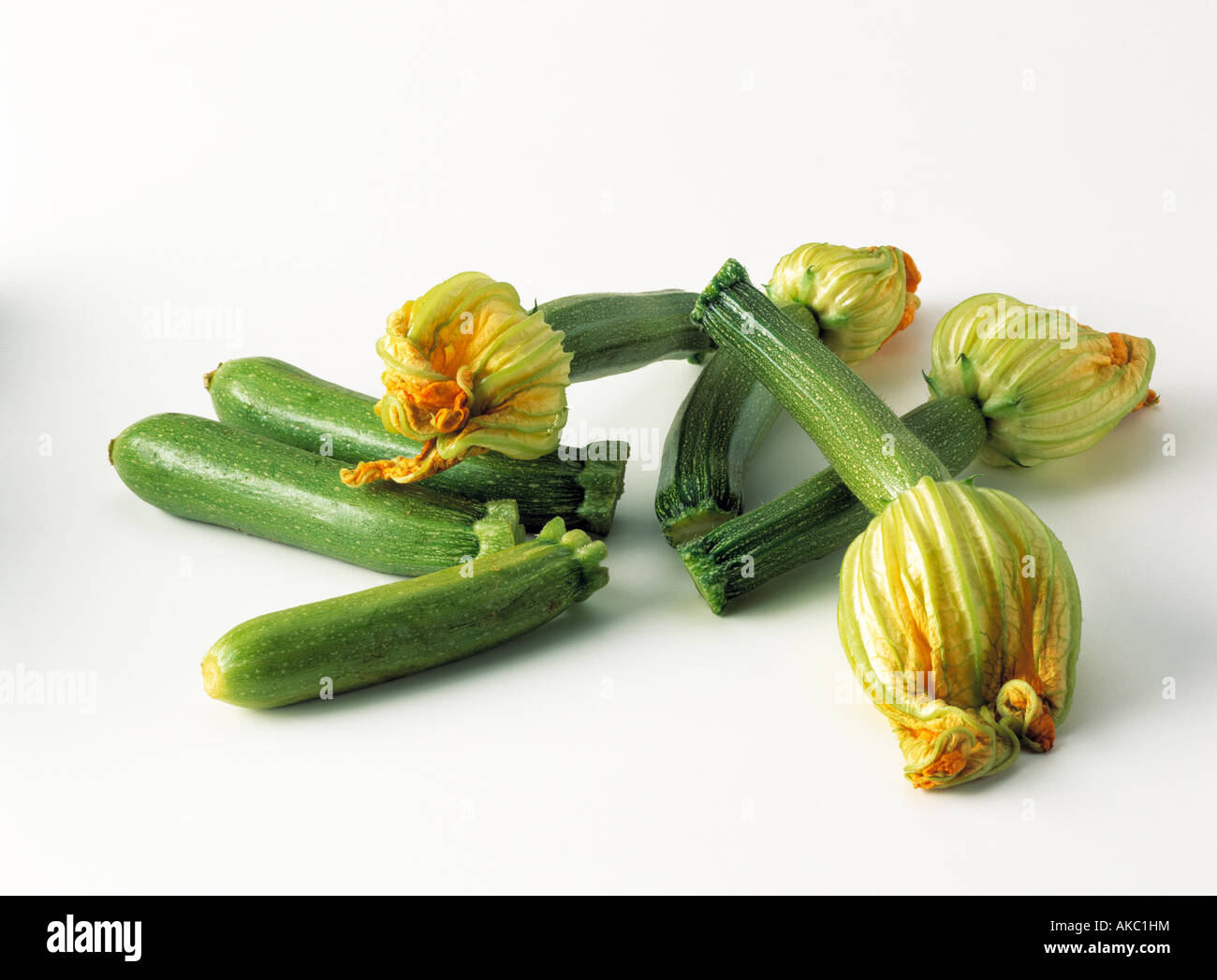 Flowering courgettes on a white background vegetarian ingredients ...