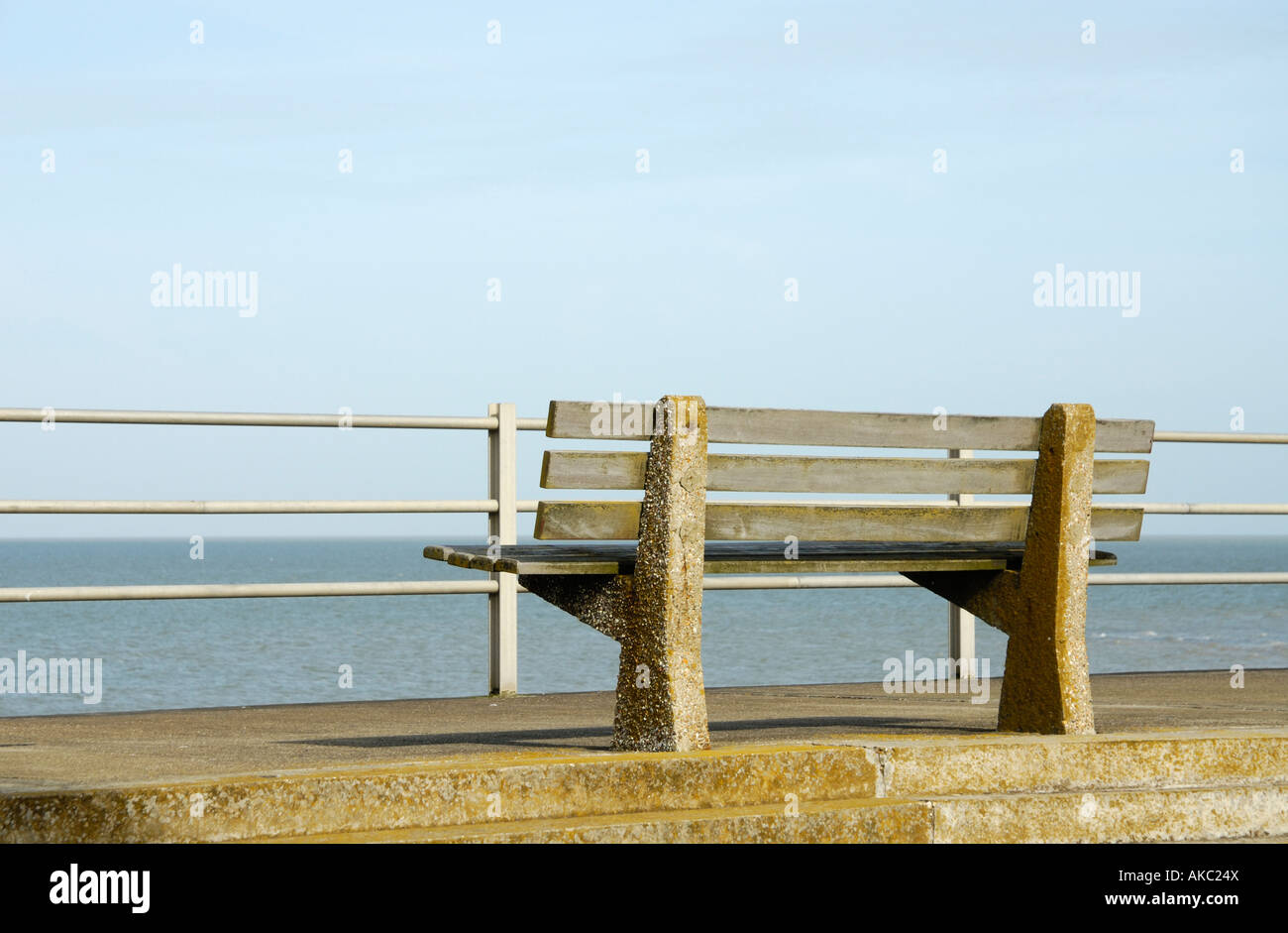 Bench on the sea wall facing out to sea at Margate Harbour Margate Kent ...
