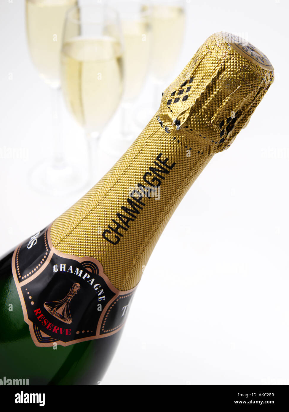 A bottle and glasses of champagne French sparkling wine on a white ...