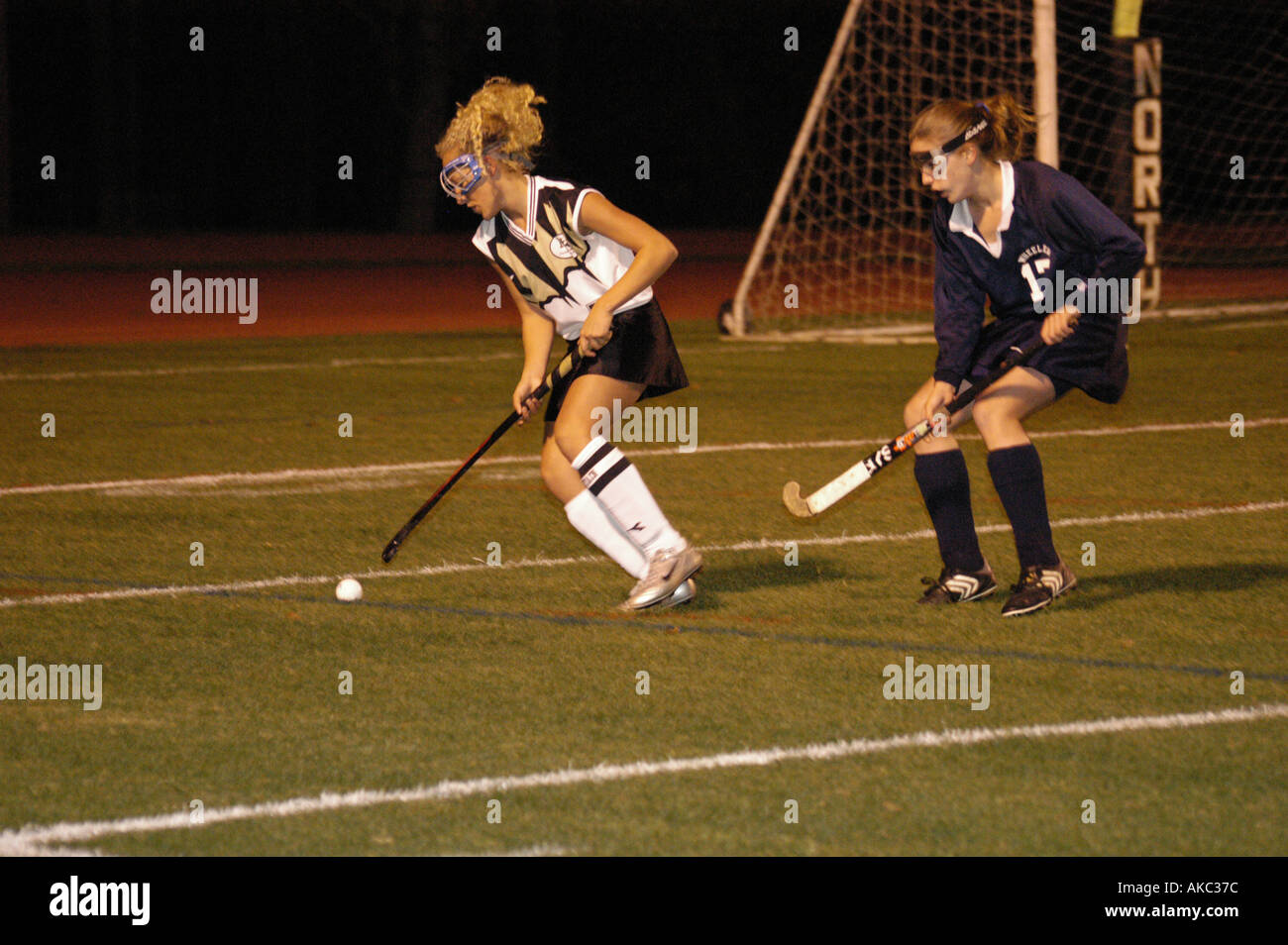 Highschool girls field hockey action Stock Photo - Alamy