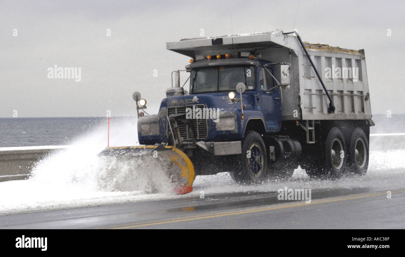 Dump truck snowplow in operation during storm Stock Photo - Alamy