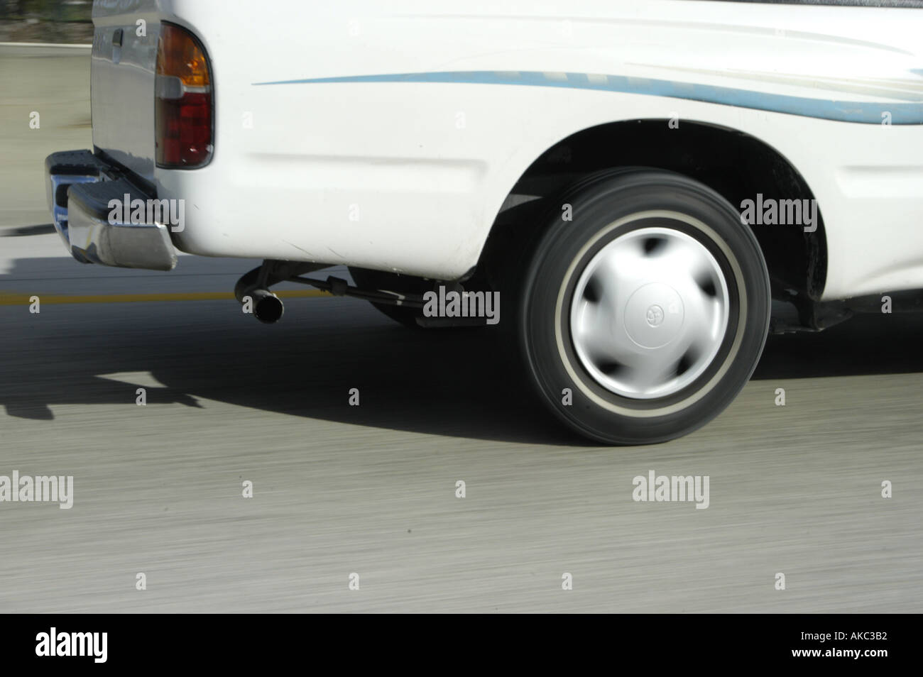 Right rear wheel of moving pickup Stock Photo - Alamy