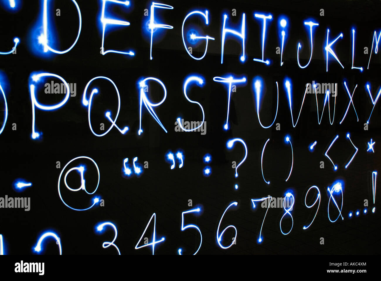 Illuminated white lettering on glass blackboard Stock Photo - Alamy