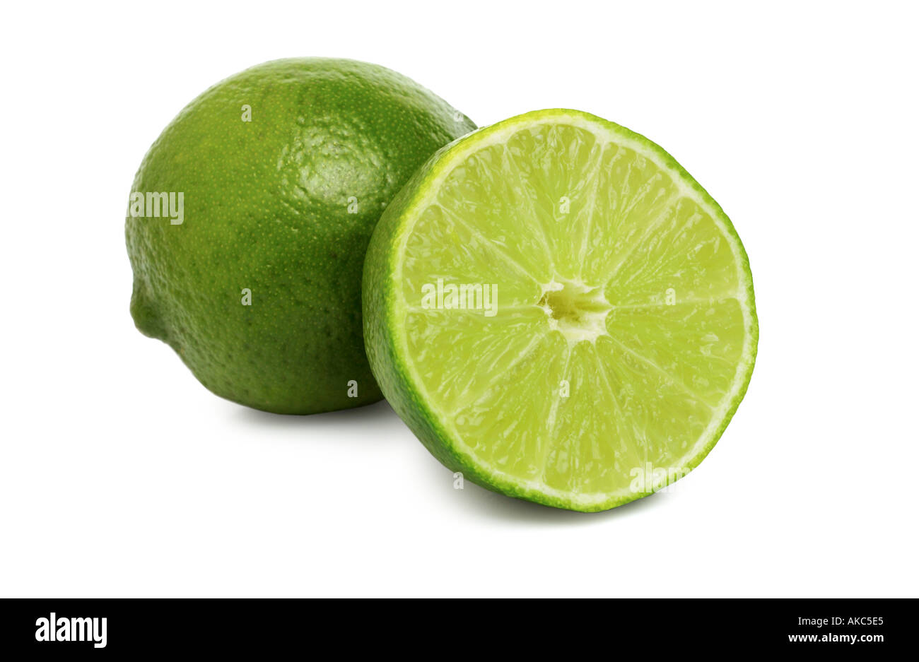 Whole and sliced lime Stock Photo - Alamy