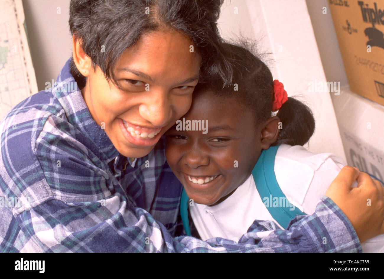 Tutor 17 with student age 6 embracing after academic victory. St Paul ...