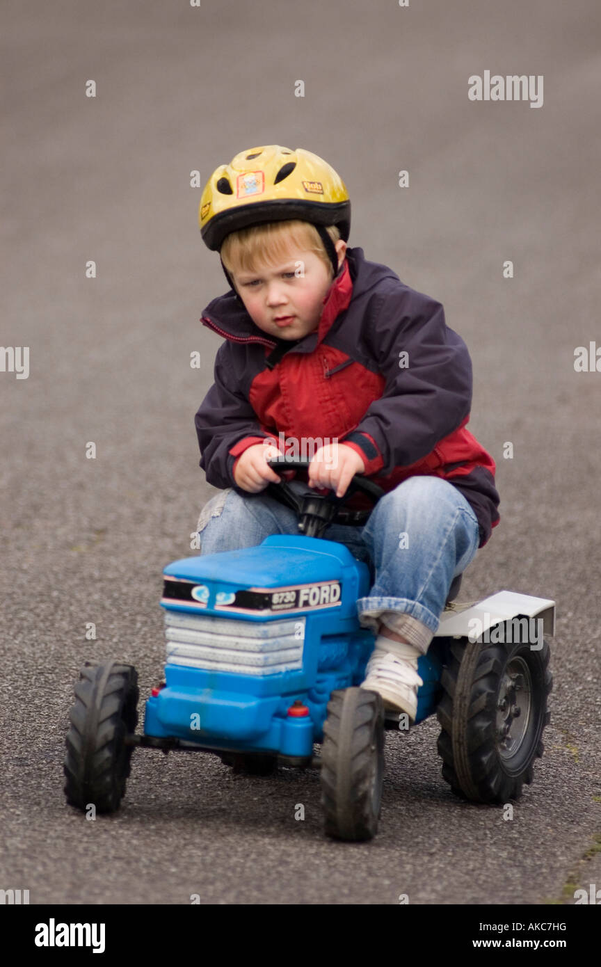 Boy driving old tractor hi-res stock photography and images - Alamy