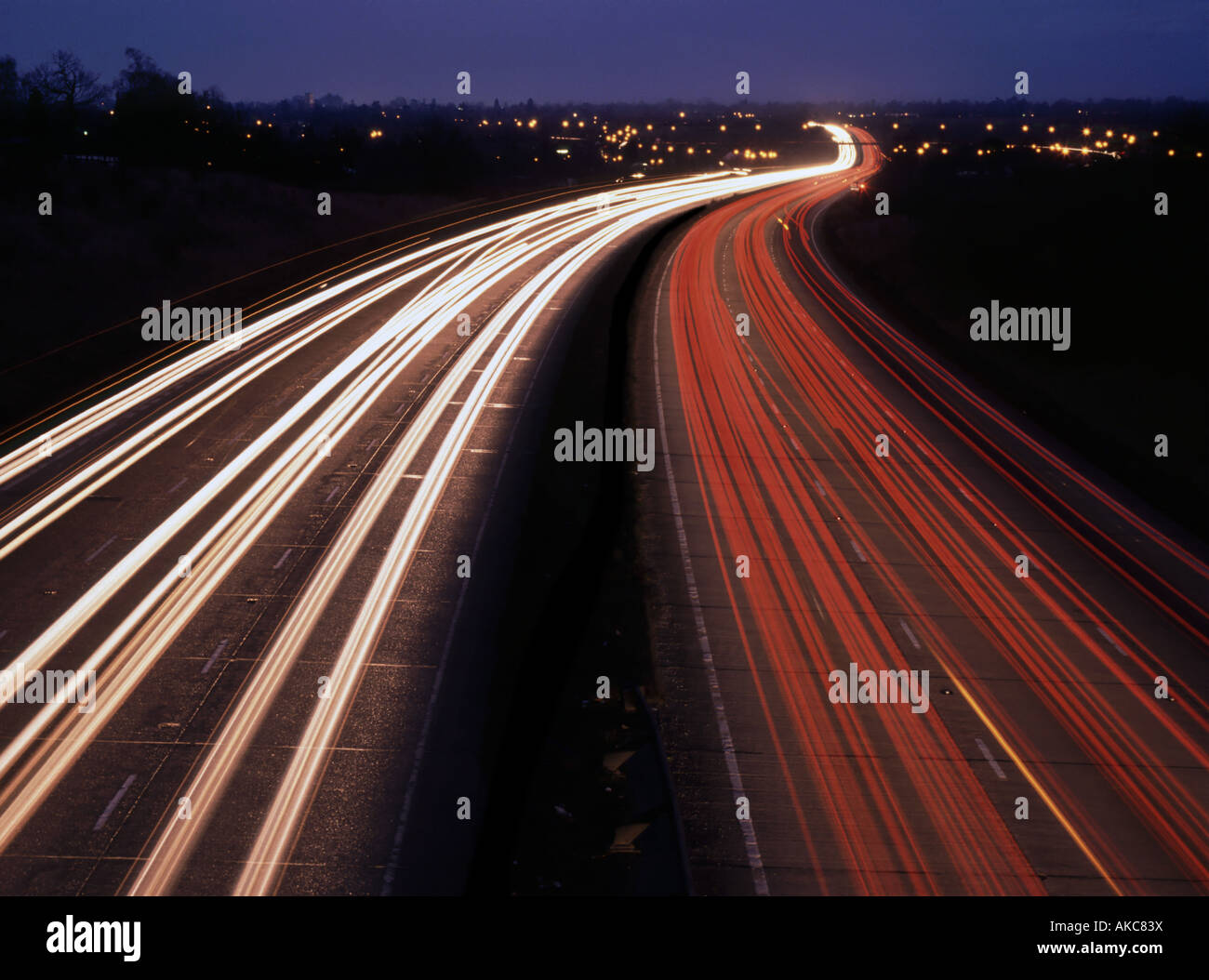 Vehicle light trails three lane dual carriageway highway on UK road at ...