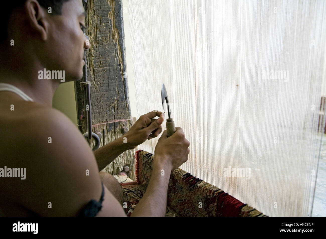 Man making a carpet. Agra. Uttar Pradesh. India Stock Photo - Alamy