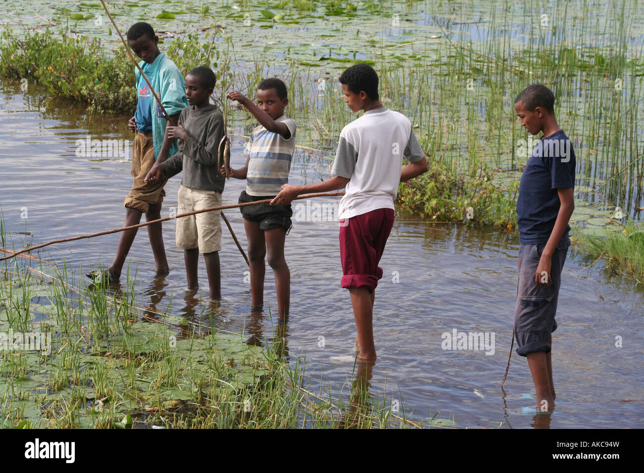 Children fishing Lake Awasa Ethiopia Stock Photo - Alamy