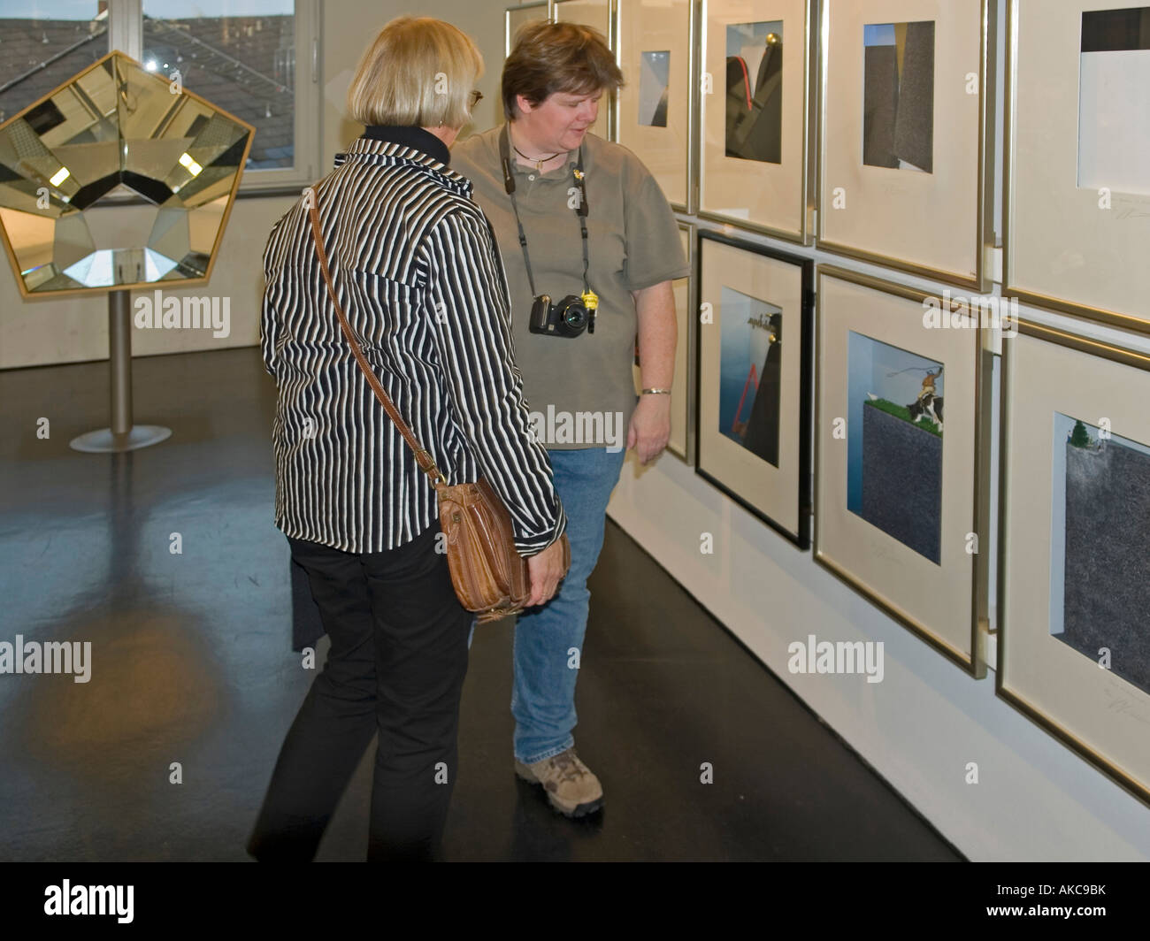 visitors viewing art objeckts in museum Stock Photo - Alamy