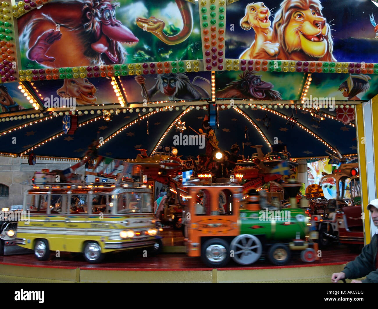 Children on a roundabout at a fun fair hi-res stock photography and ...