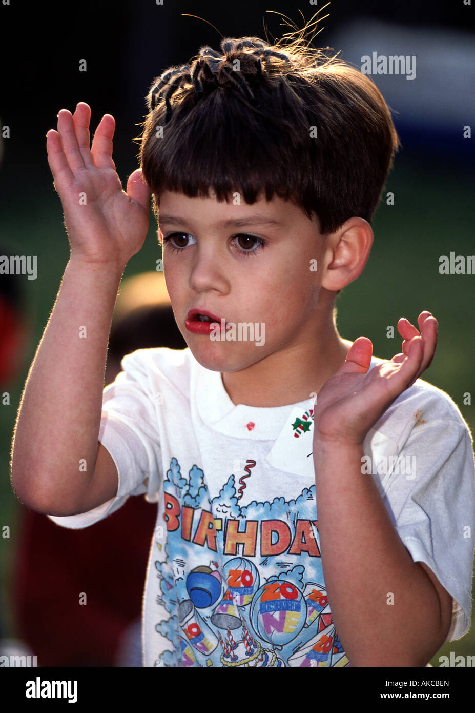 Young Caucasian boy has large Tarantula crawling on his head Stock ...