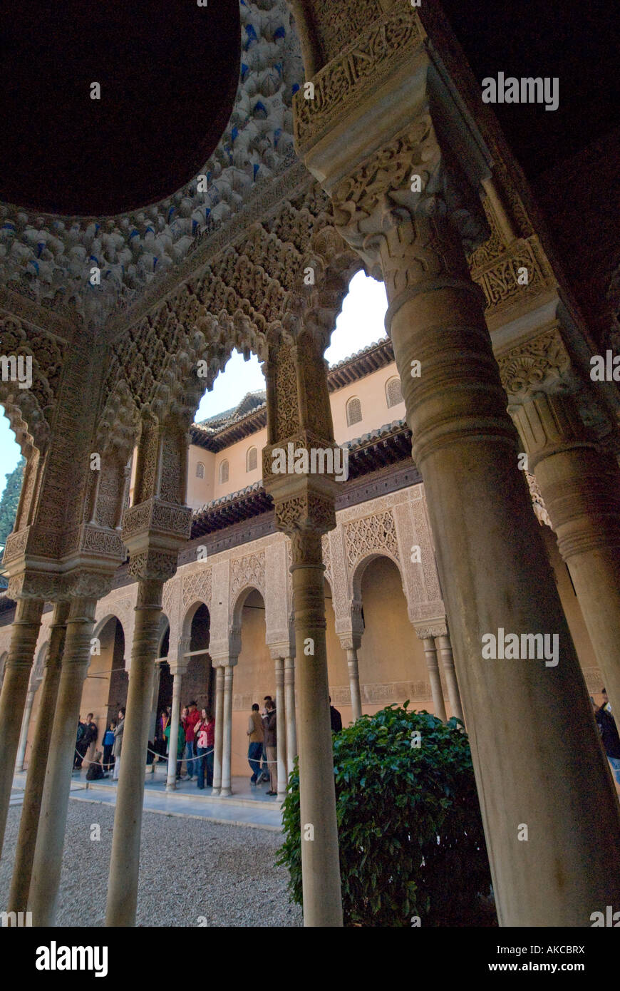 Ornate stone columns and ceiling in courtyard of the Alhambra Palace ...