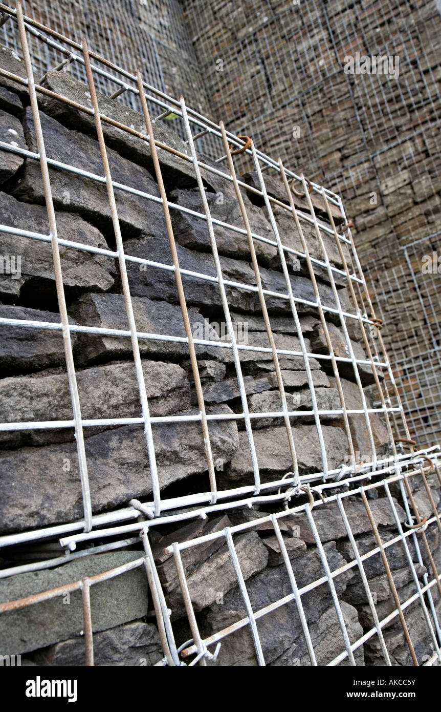 Stone in wire cages used to hold back slope alongside road Wales UK ...
