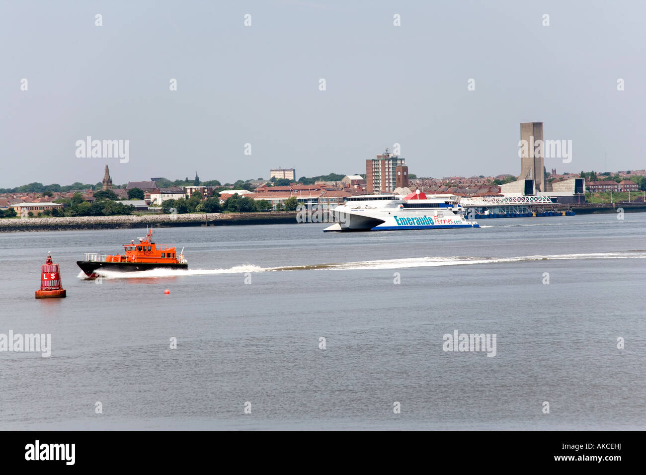 Pilot Boat heading up the Mersey River by the Albert Dock with ...