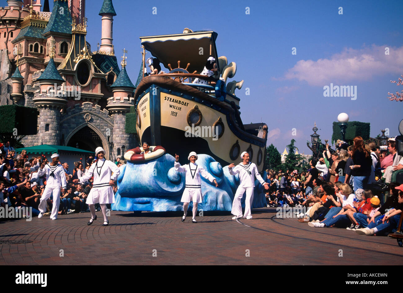A disneyland Paris parade with Mickey and Minnie Mouse on board the ...